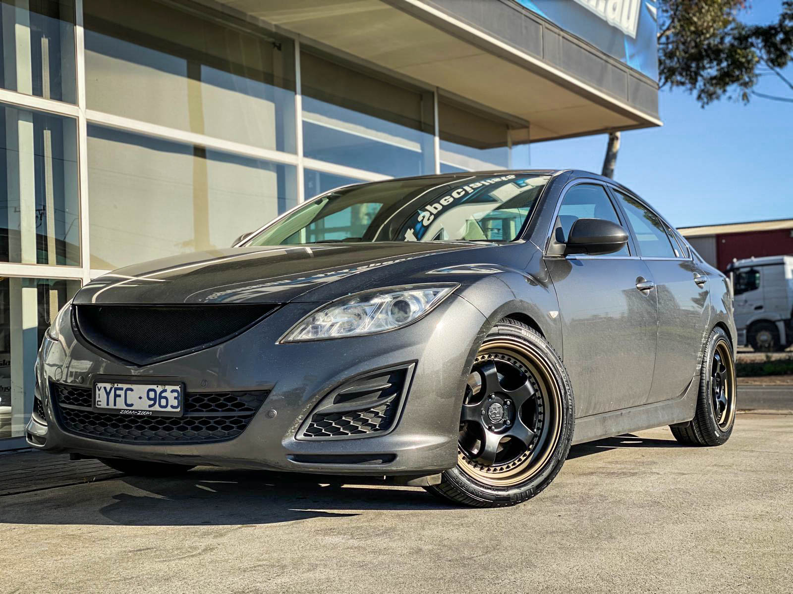 Mazda 6 hussla zen matte black gloss black rivets bronze lip #774